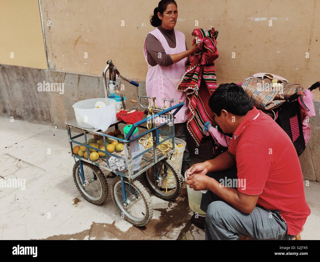 Local woman sells homemade lemonade on the streets of Cusco, Peru Stock ...