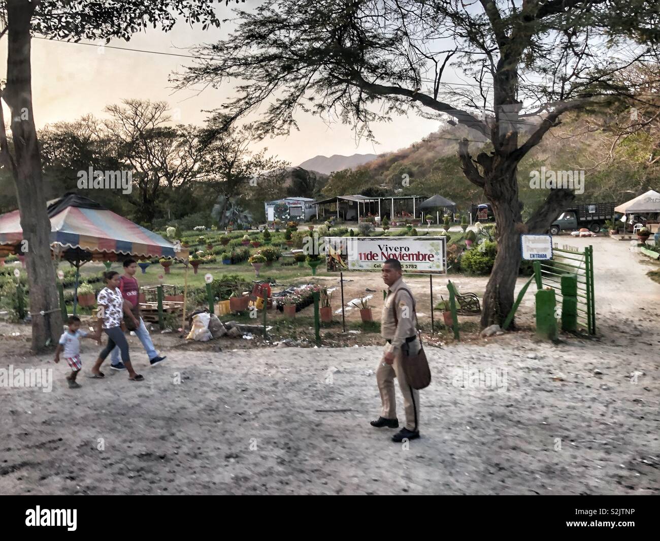 People walking on the side of a road in Santa Marta, Colombia Stock ...