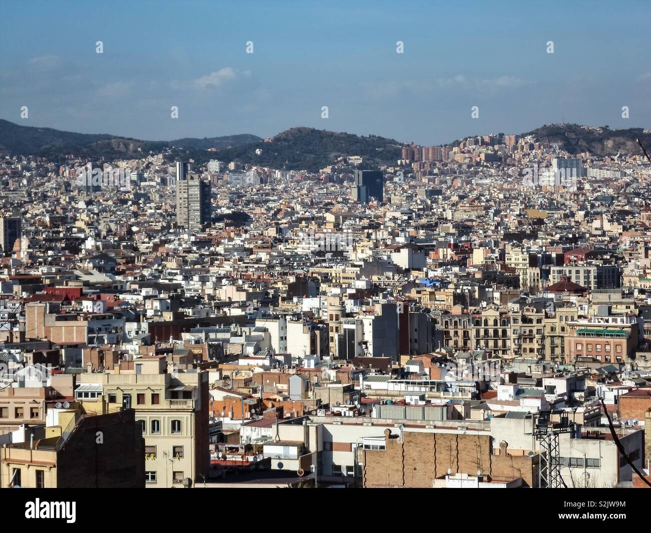 The skyline of Barcelona with the mountains as a backdrop Stock Photo ...