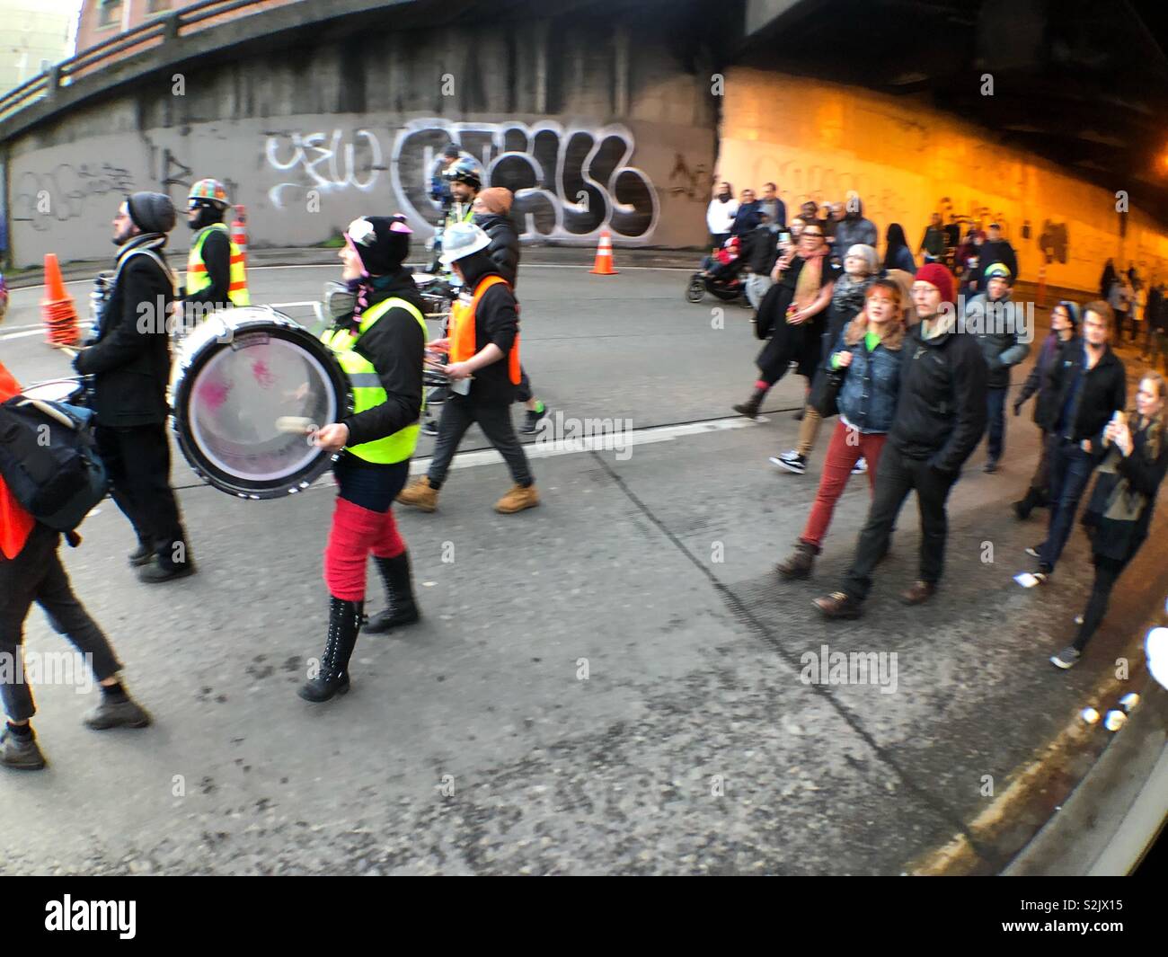 Marching band in Seattle followed by people procession Stock Photo - Alamy