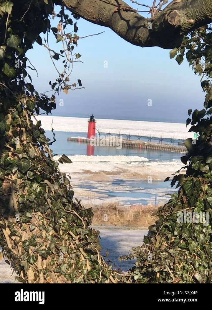 Lighthouse captured in a tree heart Stock Photo - Alamy