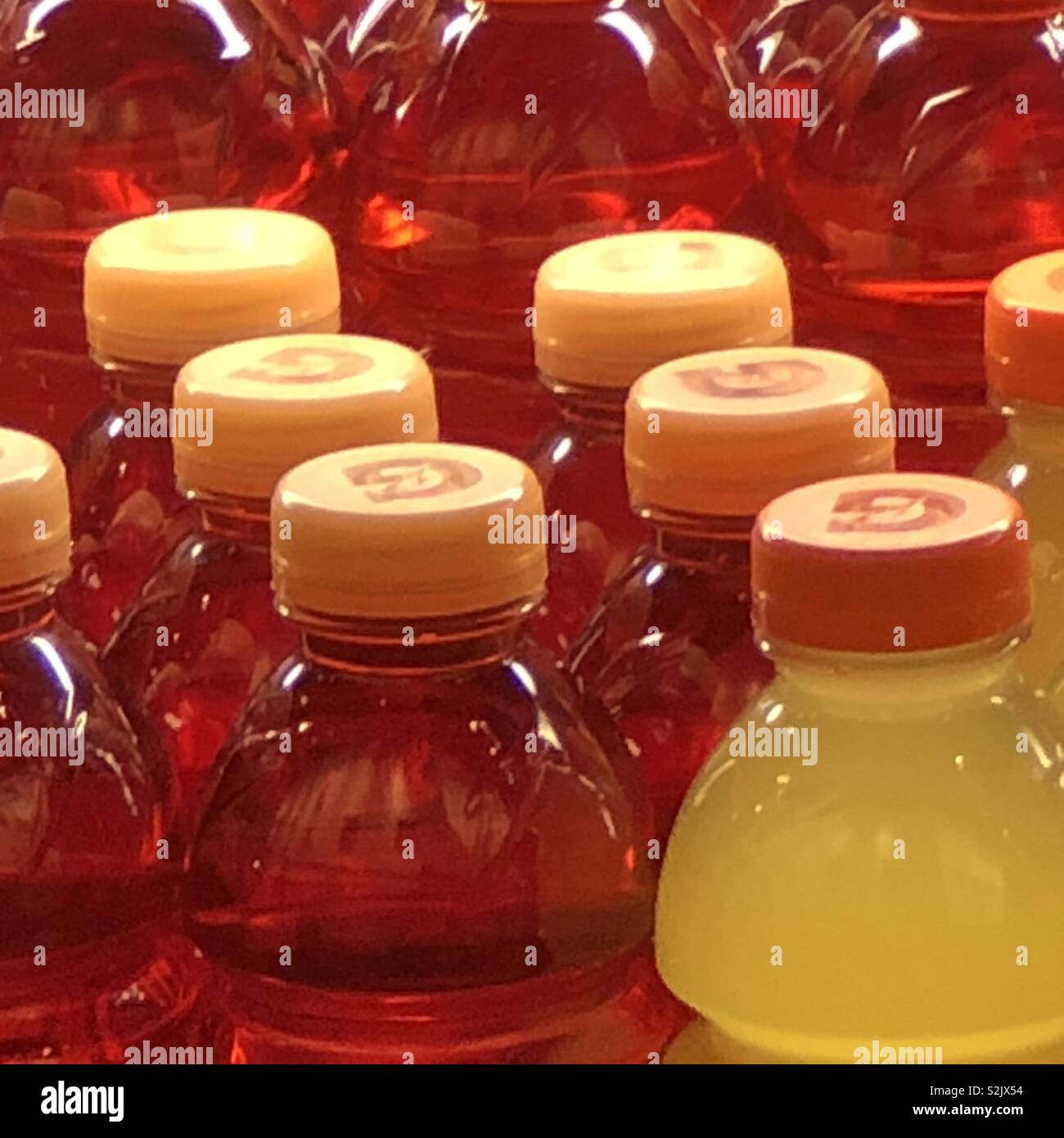 Low sugar soft drinks bottles red liquid and yellow liquid Stock Photo ...