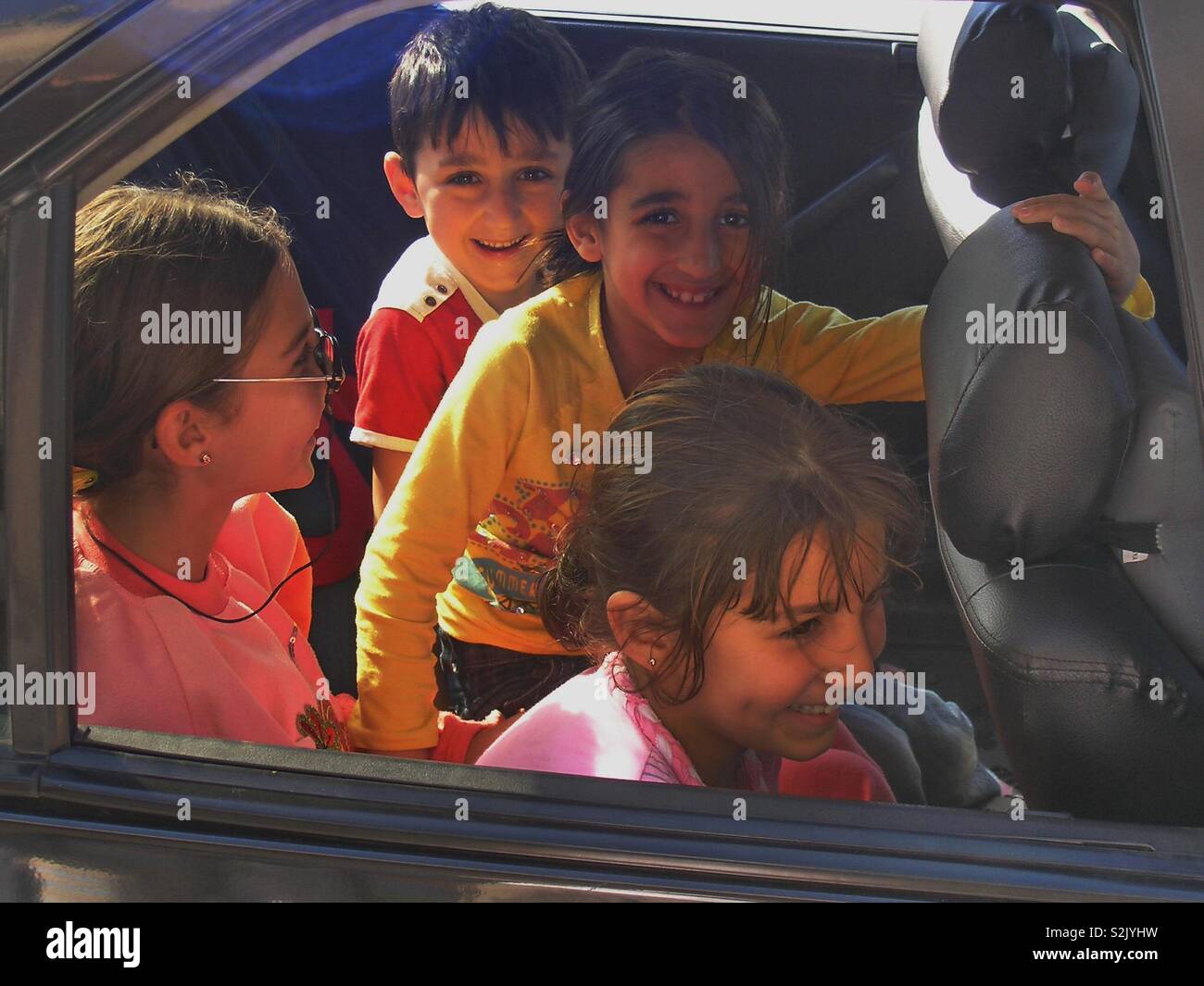 Happy children in the car Stock Photo - Alamy