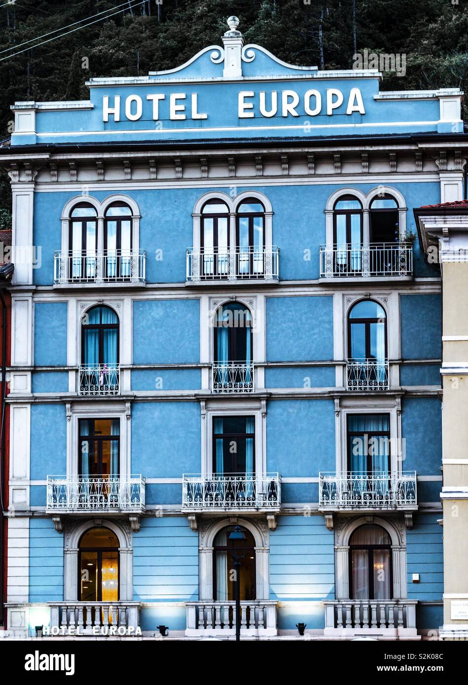 Vintage facade for an hold hotel in lake Garda with bright blue color ...