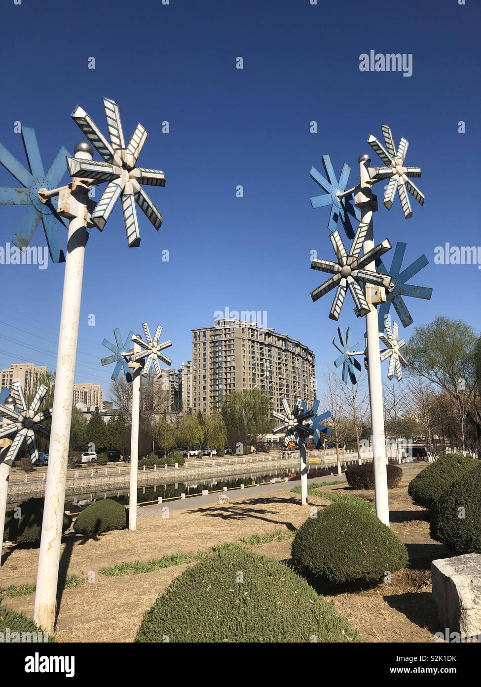 Windmill features on riverside park in Beijing Stock Photo - Alamy