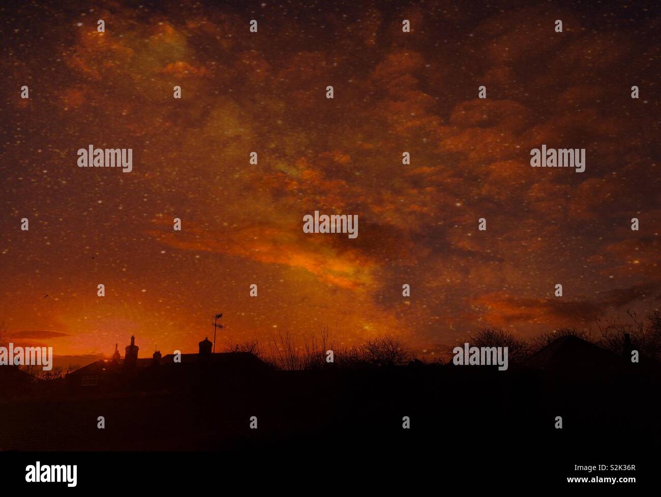 Red, brooding clouds at sunrise with silhouette Stock Photo - Alamy