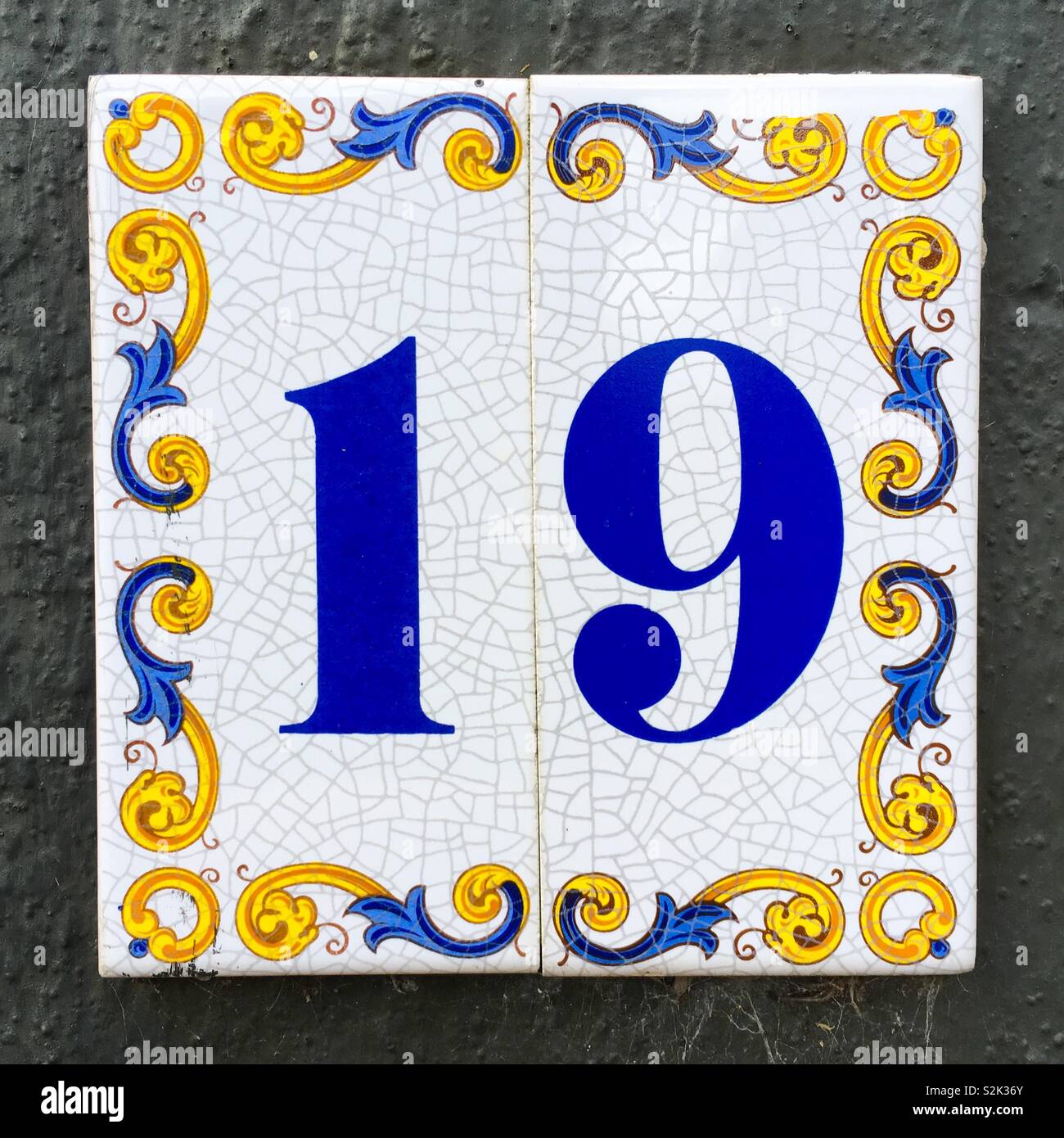 Crackled tiles with numbers one and nine for house number nineteen ...