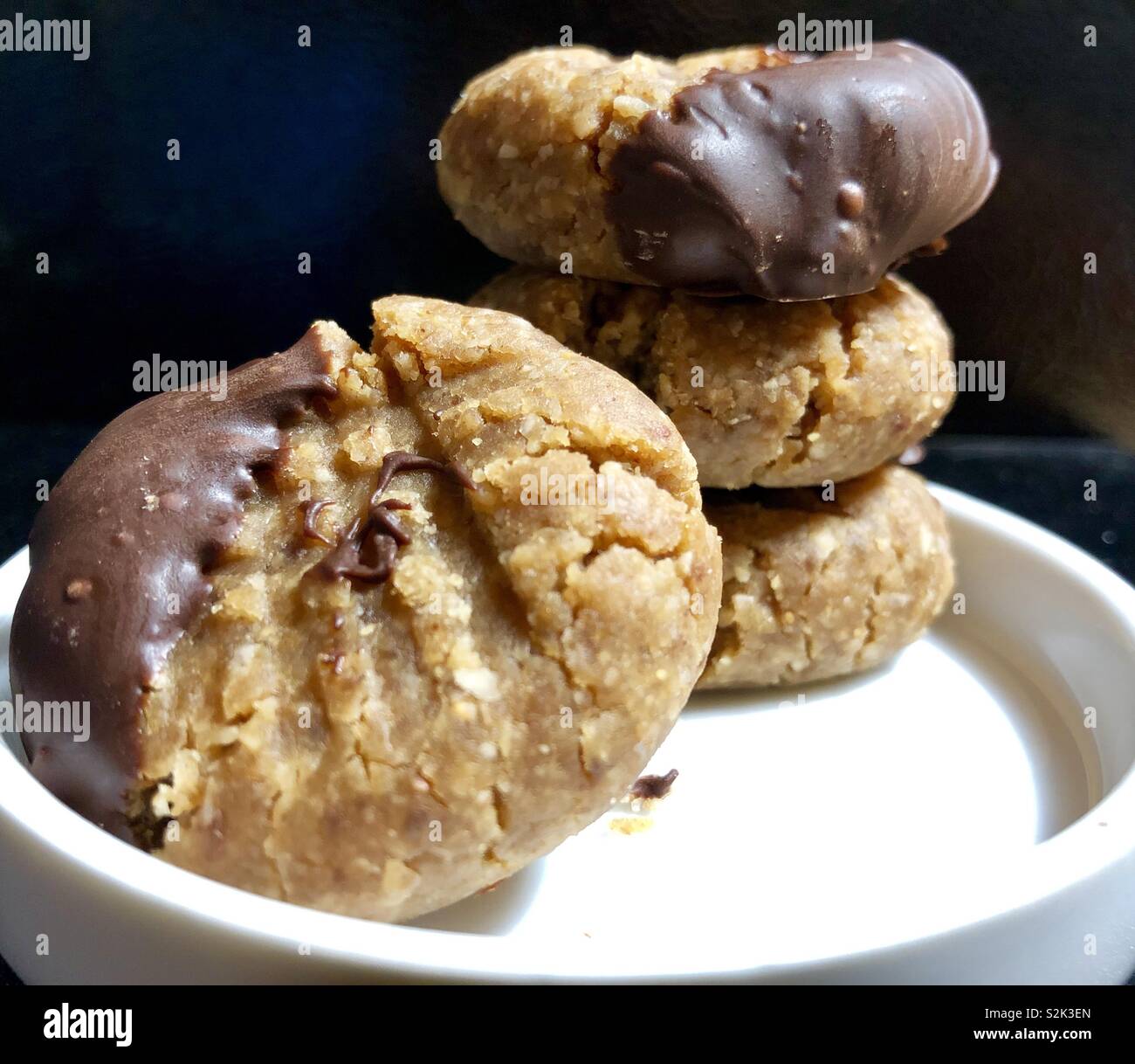 Stacked nut butter cookies with chocolate Stock Photo - Alamy