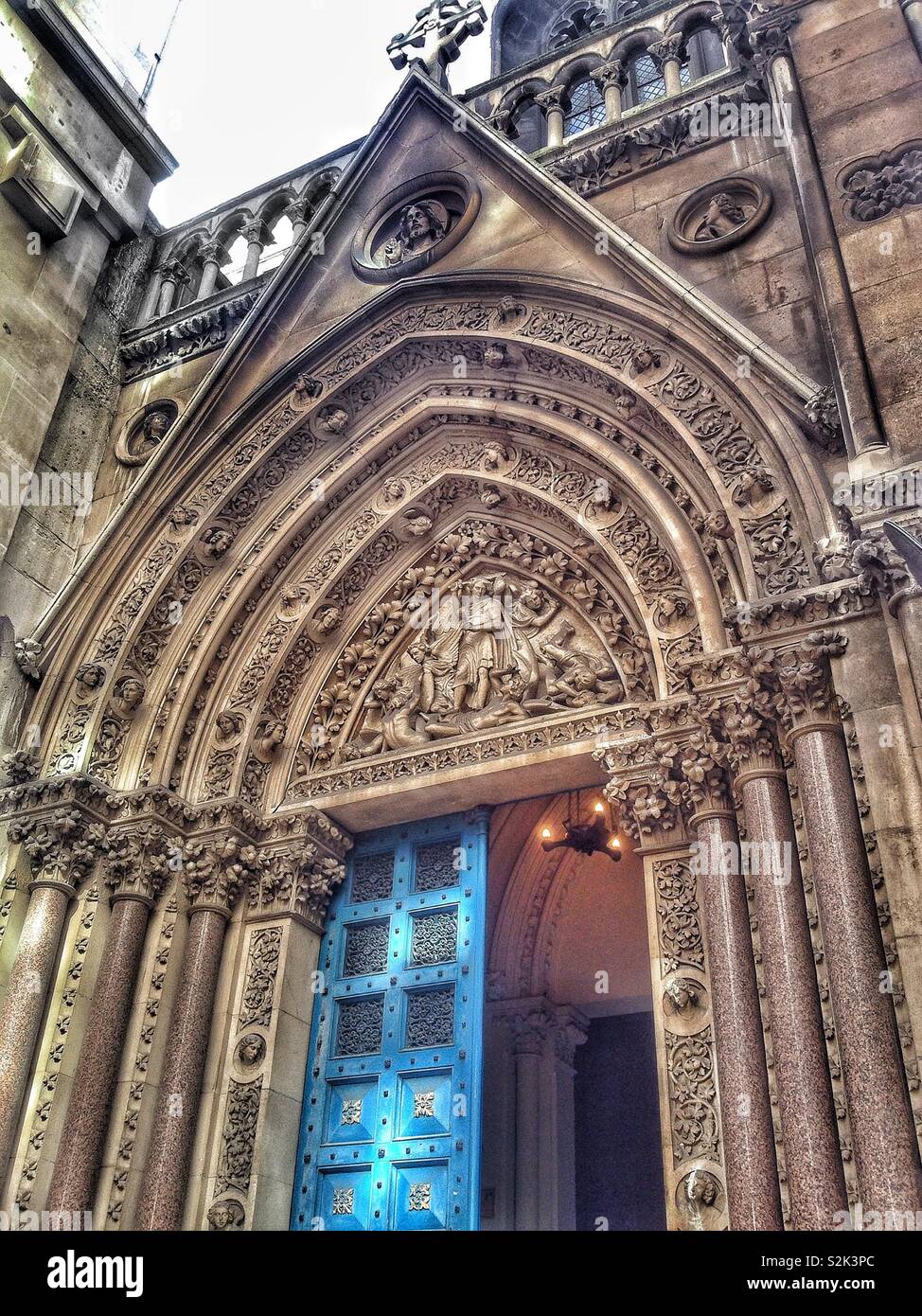 The ornate Franco-Italian Gothic architecture of the porch entrance to ...