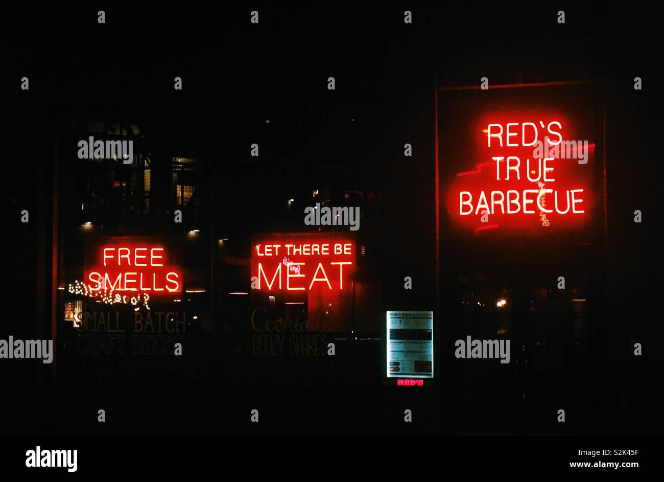 A barbeque meat restaurant with red neon signs Stock Photo - Alamy