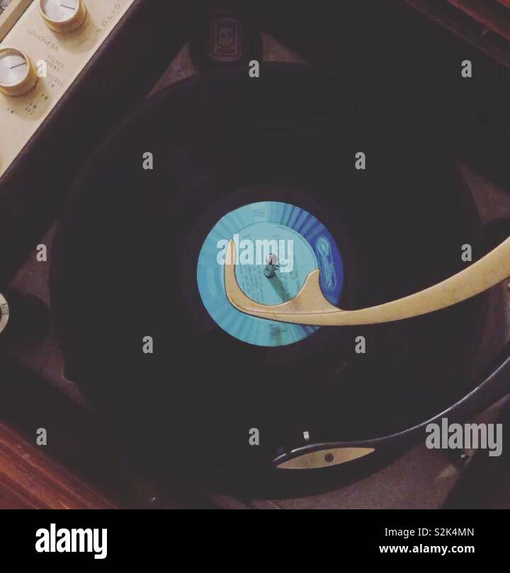 Record player playing a record Stock Photo - Alamy