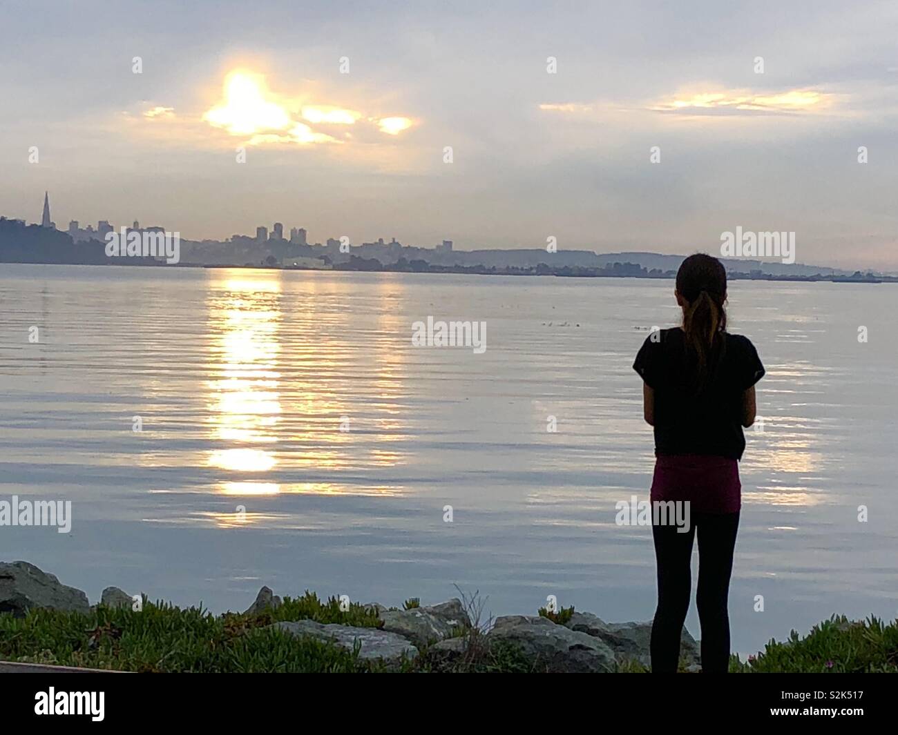 Girl looking at the sunset hi-res stock photography and images - Alamy