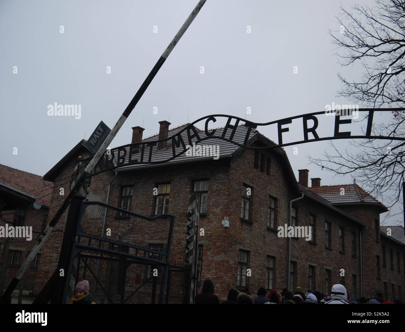 Auschwitz sign and barrier Stock Photo - Alamy