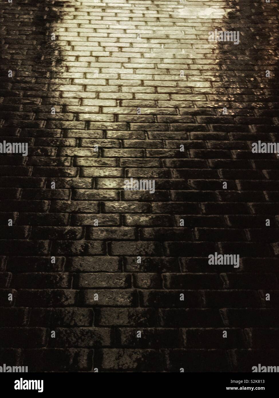 Huge masonry brick walkway on a rainy night Stock Photo - Alamy