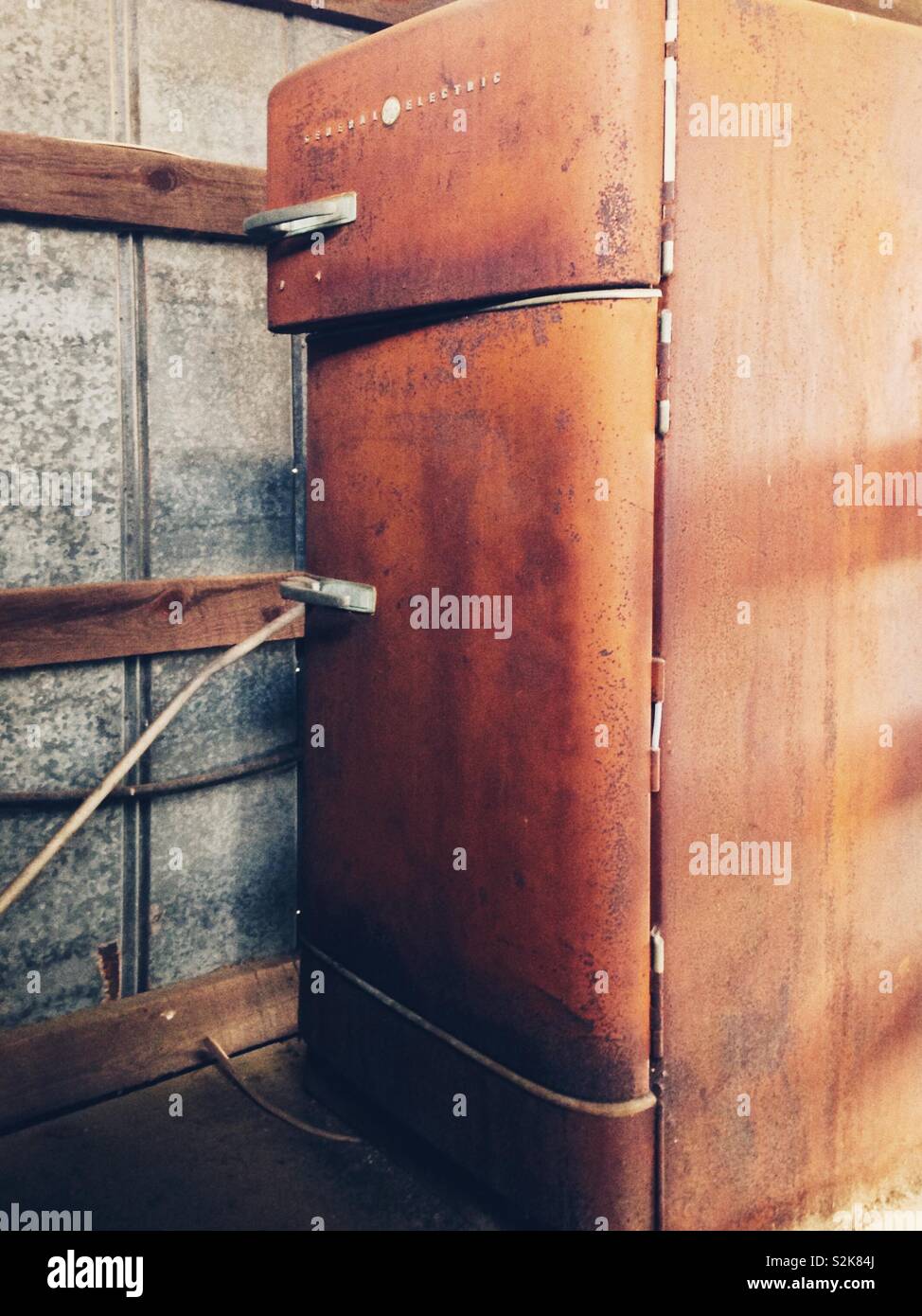 Old rusted refrigerator in a barn Stock Photo - Alamy