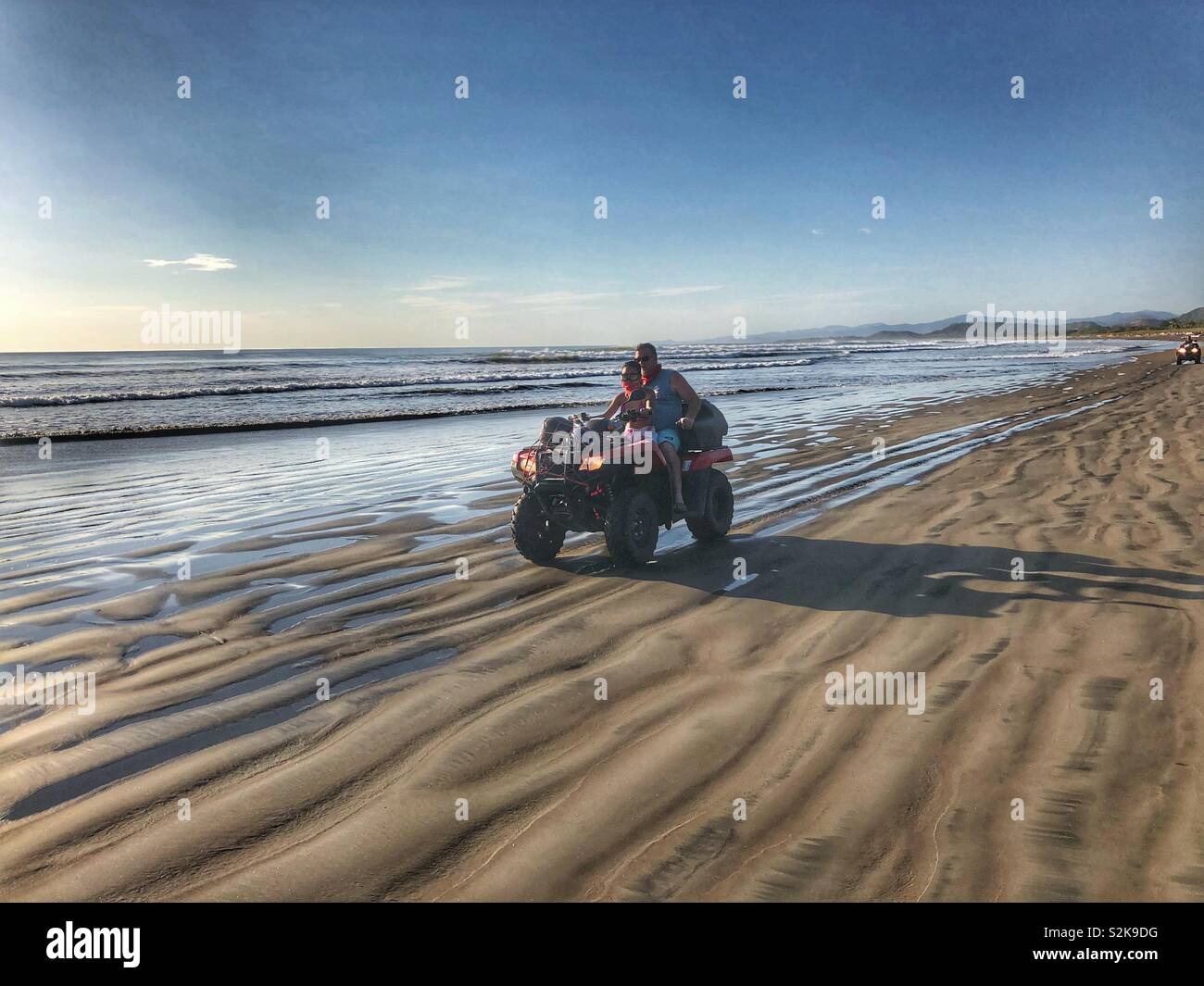 Buggy riding on the beach Stock Photo - Alamy