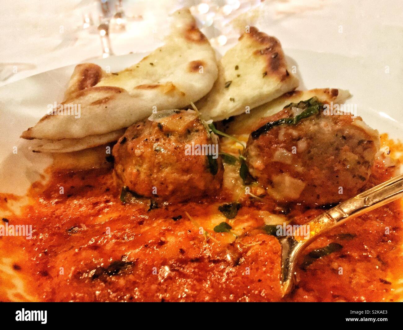 Formal dinner plate of Mediterranean meatballs served with traditional ...
