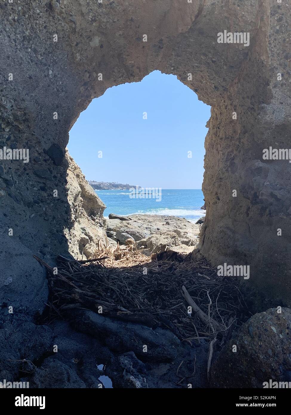 Beach through a cave hi-res stock photography and images - Alamy