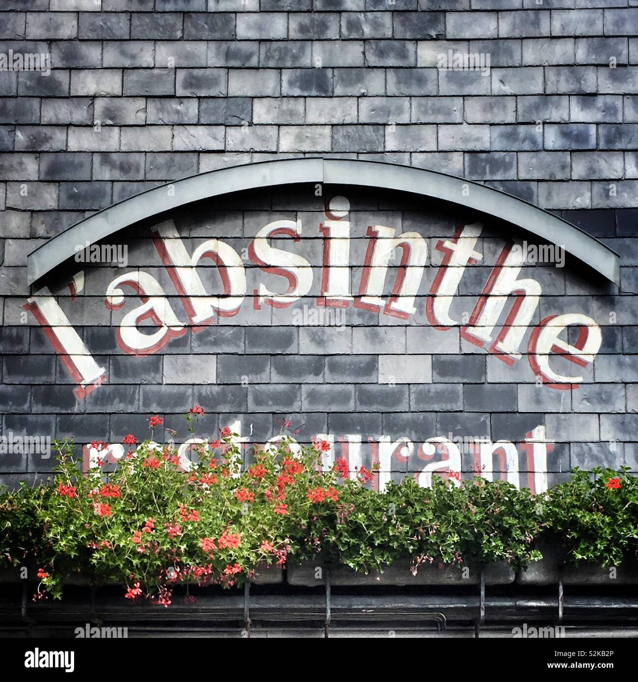 L’absinthe sign painted on slate roof Stock Photo - Alamy