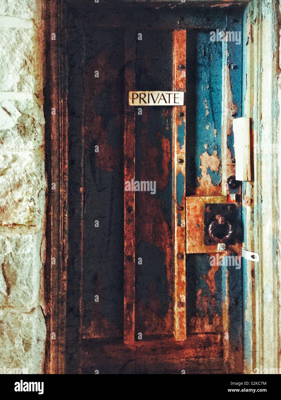 Rustic, old, brown and blue door labelled PRIVATE Stock Photo - Alamy