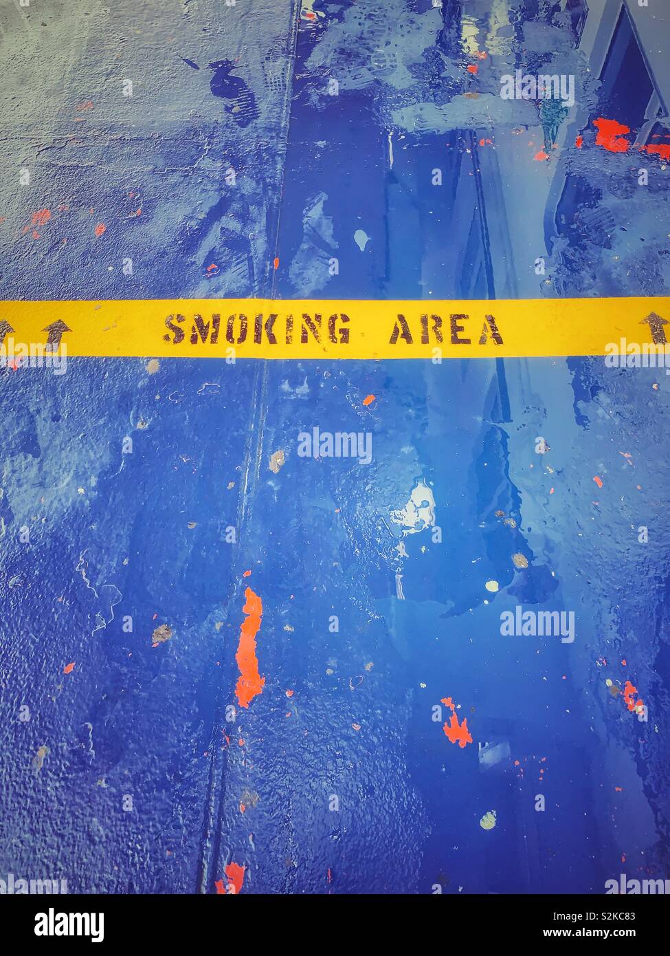 Smoking area sign on the deck of a ship Stock Photo - Alamy