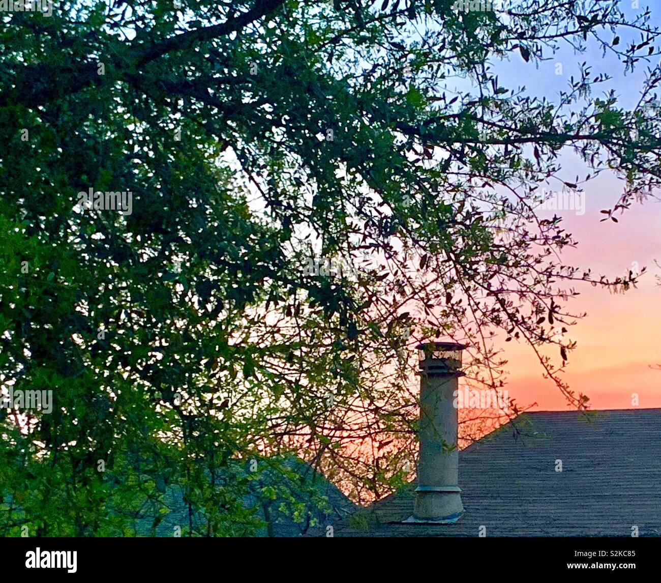Morning sunrise behind old school chimney from my backyard Stock Photo ...