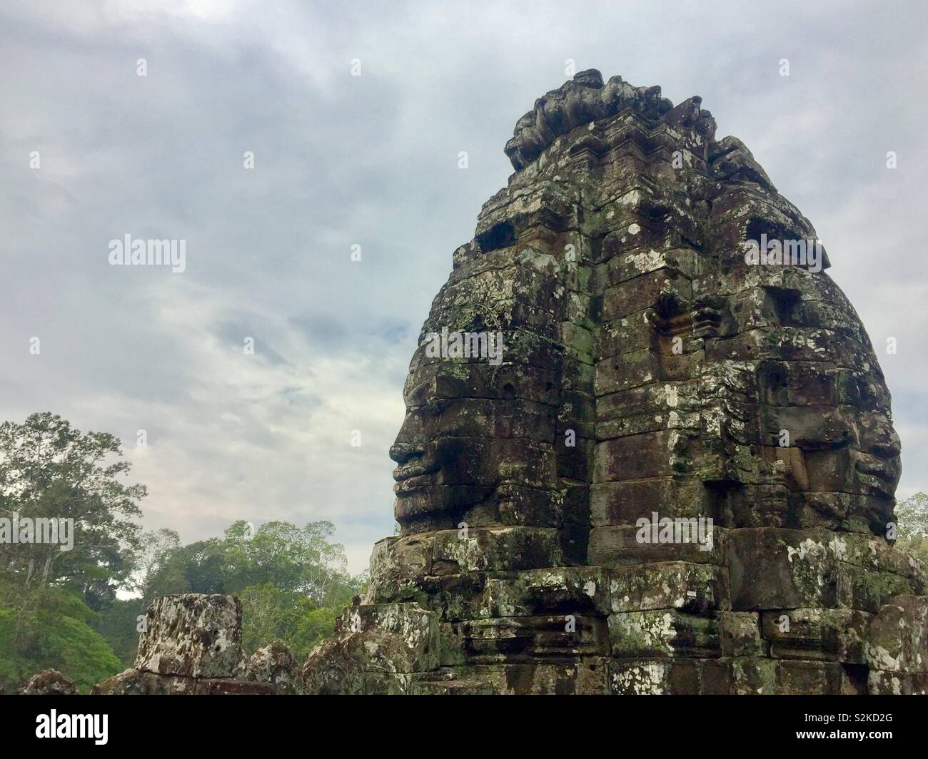Moss covered faces of Angkor Tom, cambodia Stock Photo - Alamy
