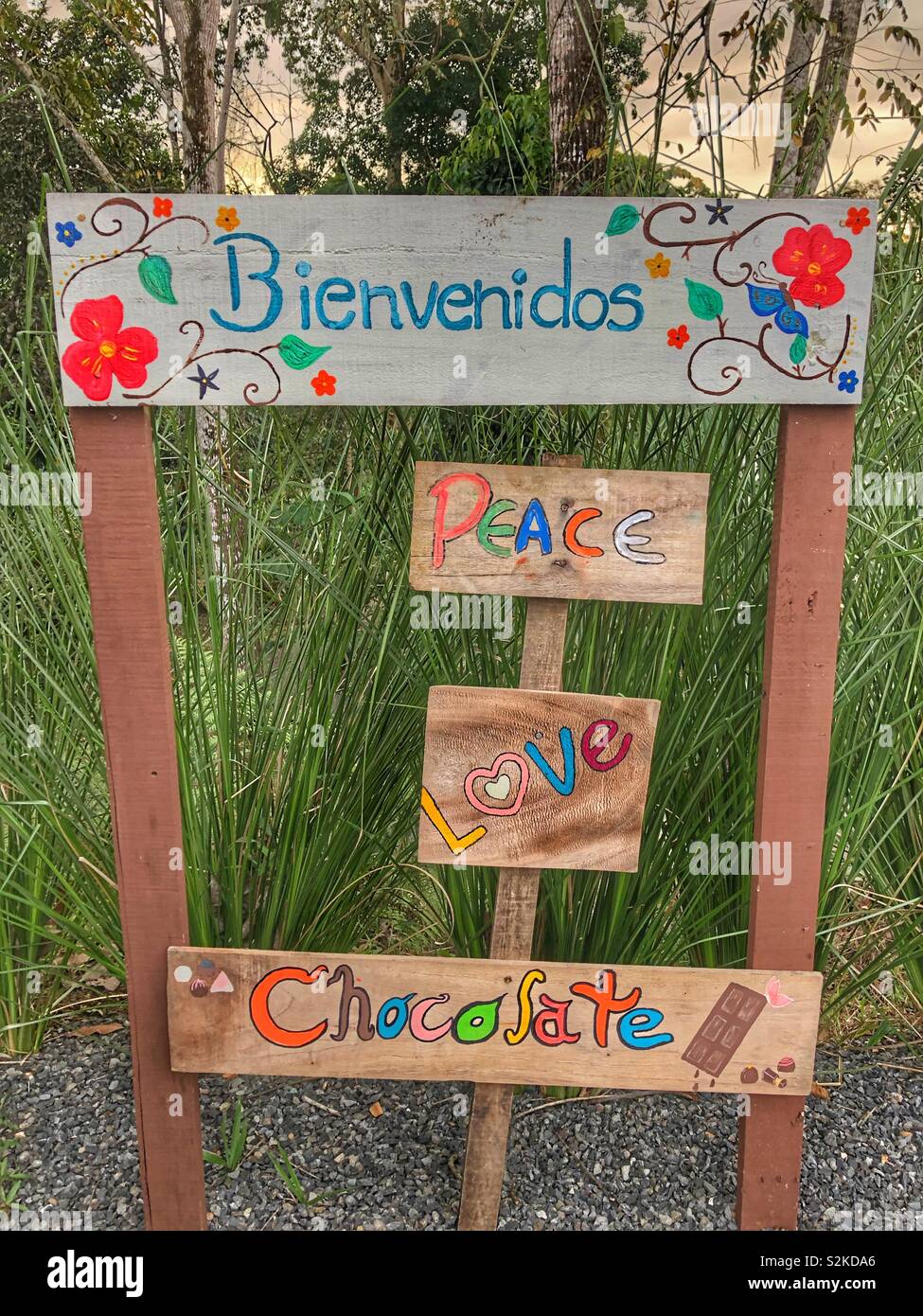 A wooden welcome sign at a chocolate plantation Stock Photo - Alamy