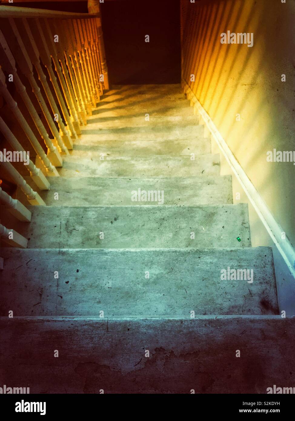 Looking down creepy, dirty stairs with sidelight creating shadows Stock ...