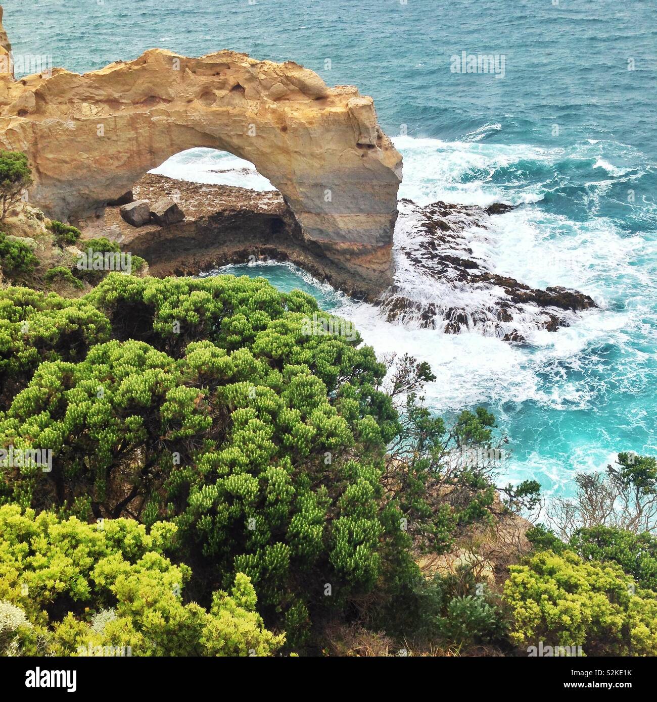 Arch in water near Port Campbell Australia Stock Photo - Alamy