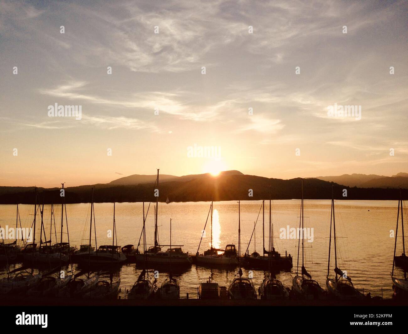 Sunset overlooking harbour Stock Photo - Alamy