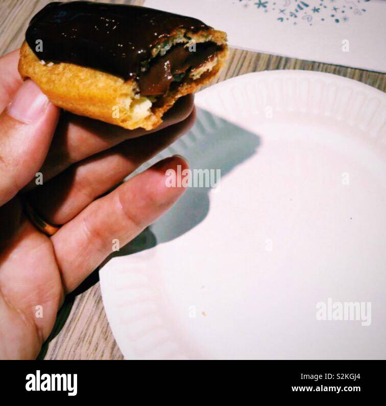 Man eating lovely French patisserie in sunshine Stock Photo - Alamy