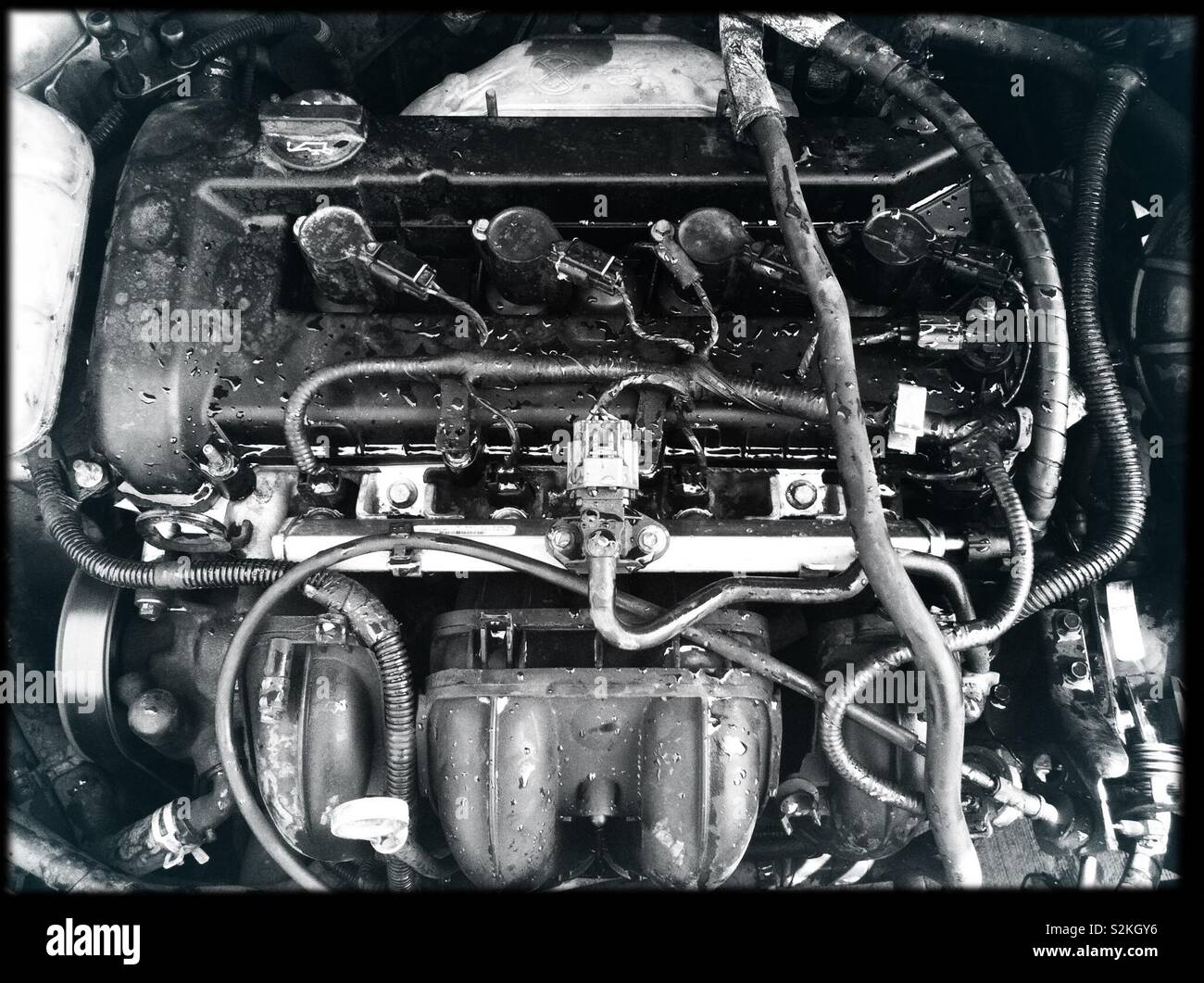 Open car engine about to be repaired by mechanic Stock Photo - Alamy