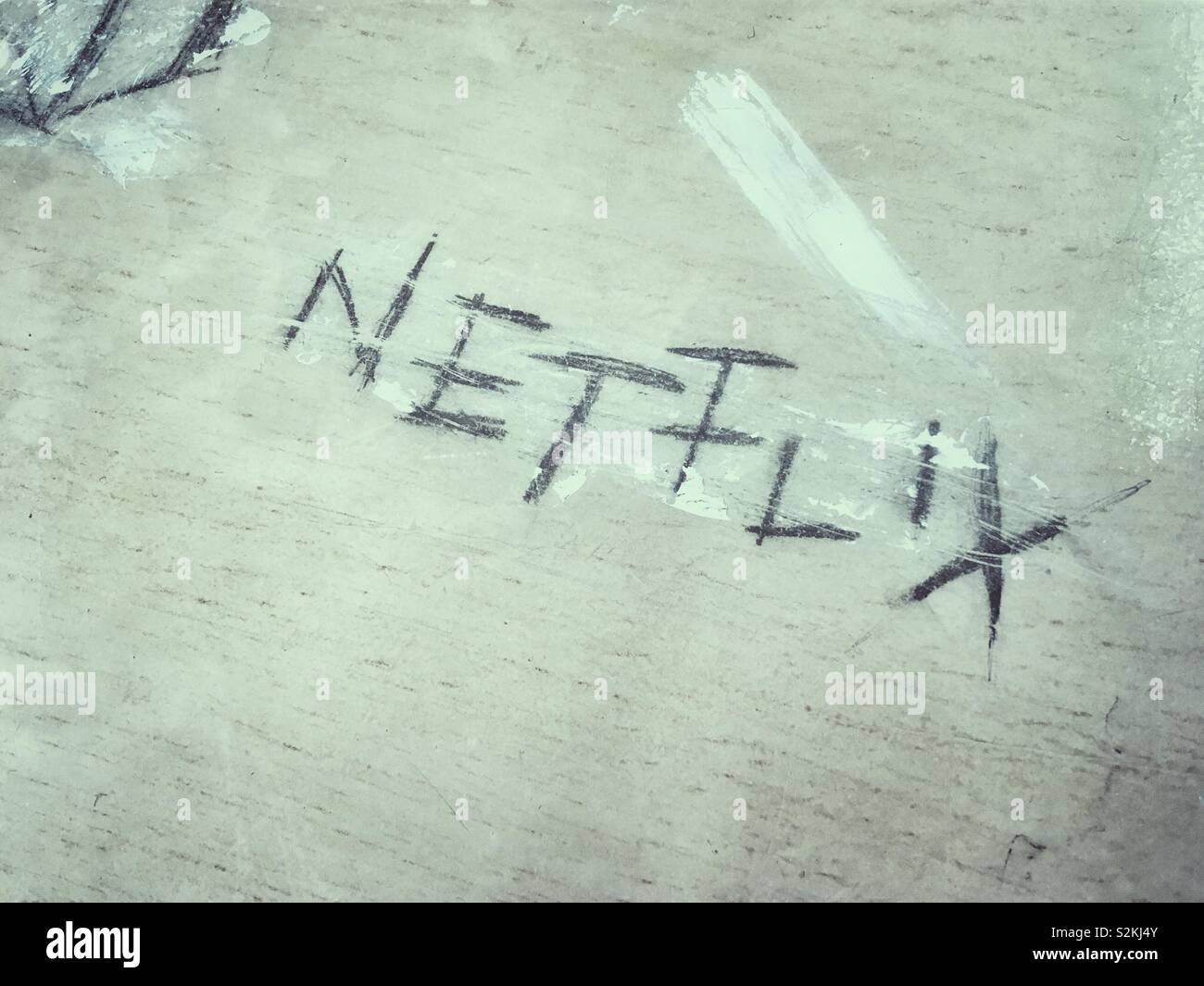 Netflix written with a pencil on a wooden surface Stock Photo - Alamy