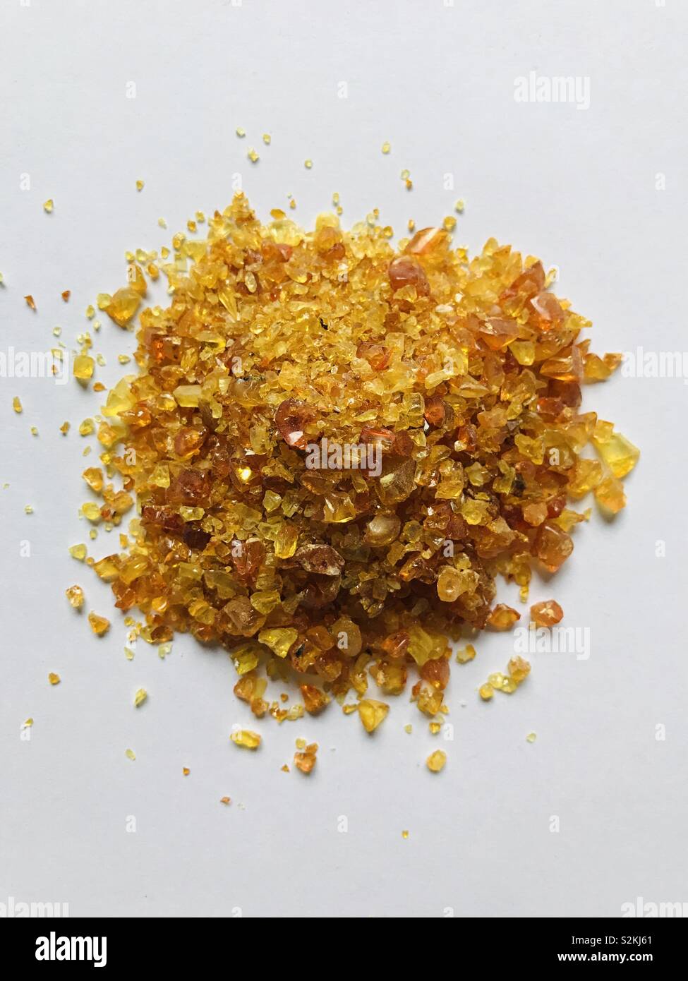 Crushed Natural Amber. Small pieces and amber dust Stock Photo - Alamy