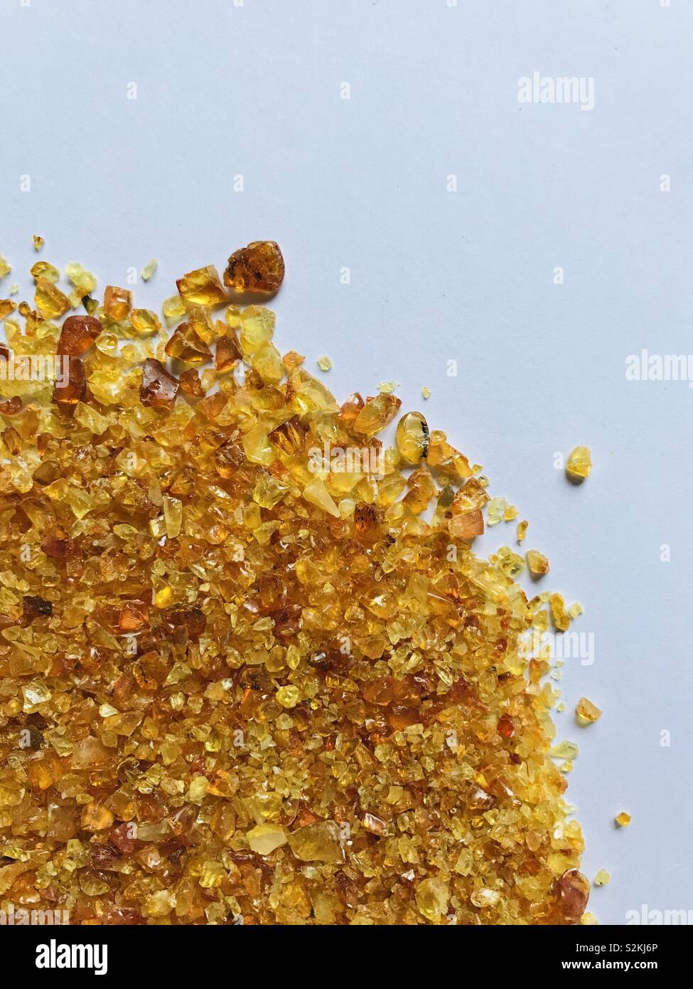 Raw natural crushed Amber Stock Photo - Alamy