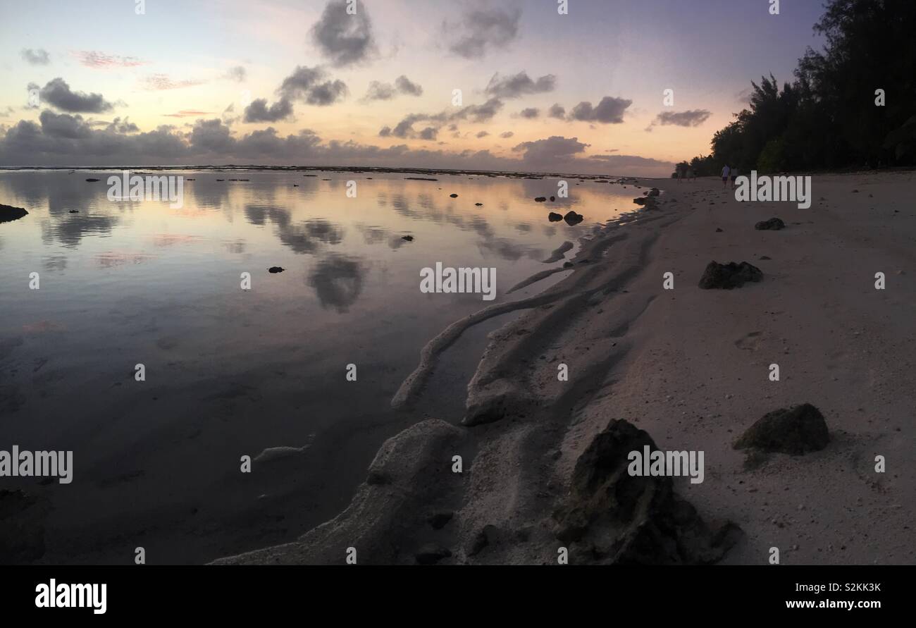 Sun setting over beach, Rarotonga, Cook Islands Stock Photo - Alamy