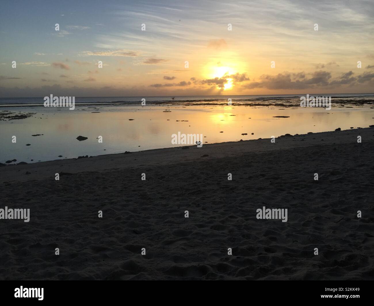 Sunsetting over beach Rarotonga, Cook Islands Stock Photo - Alamy