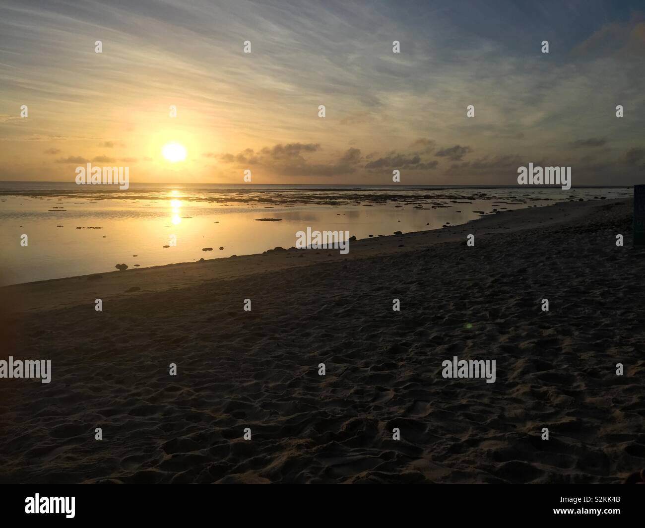 Sun setting over beach, Rarotonga, Cook Islands Stock Photo - Alamy