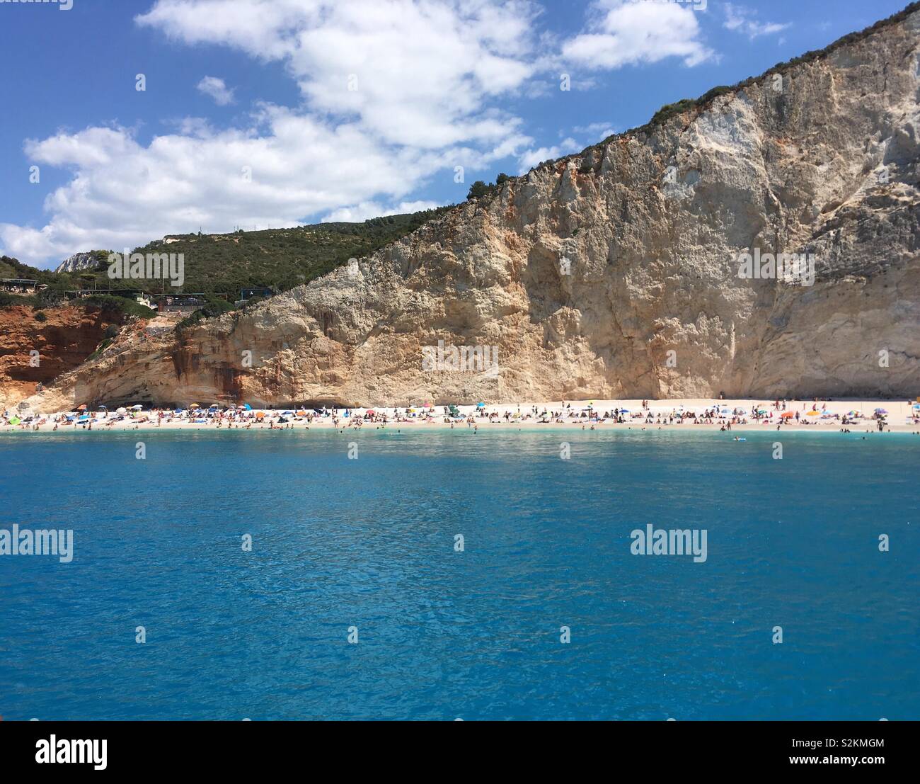People are swimming and sun bathing on the beach; Lefkada, Greece Stock ...