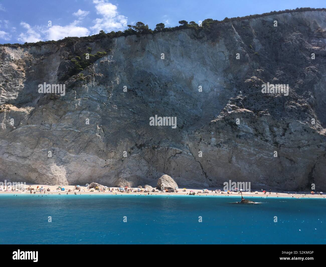 People are swimming and sun bathing on the beach; Lefkada, Greece Stock ...