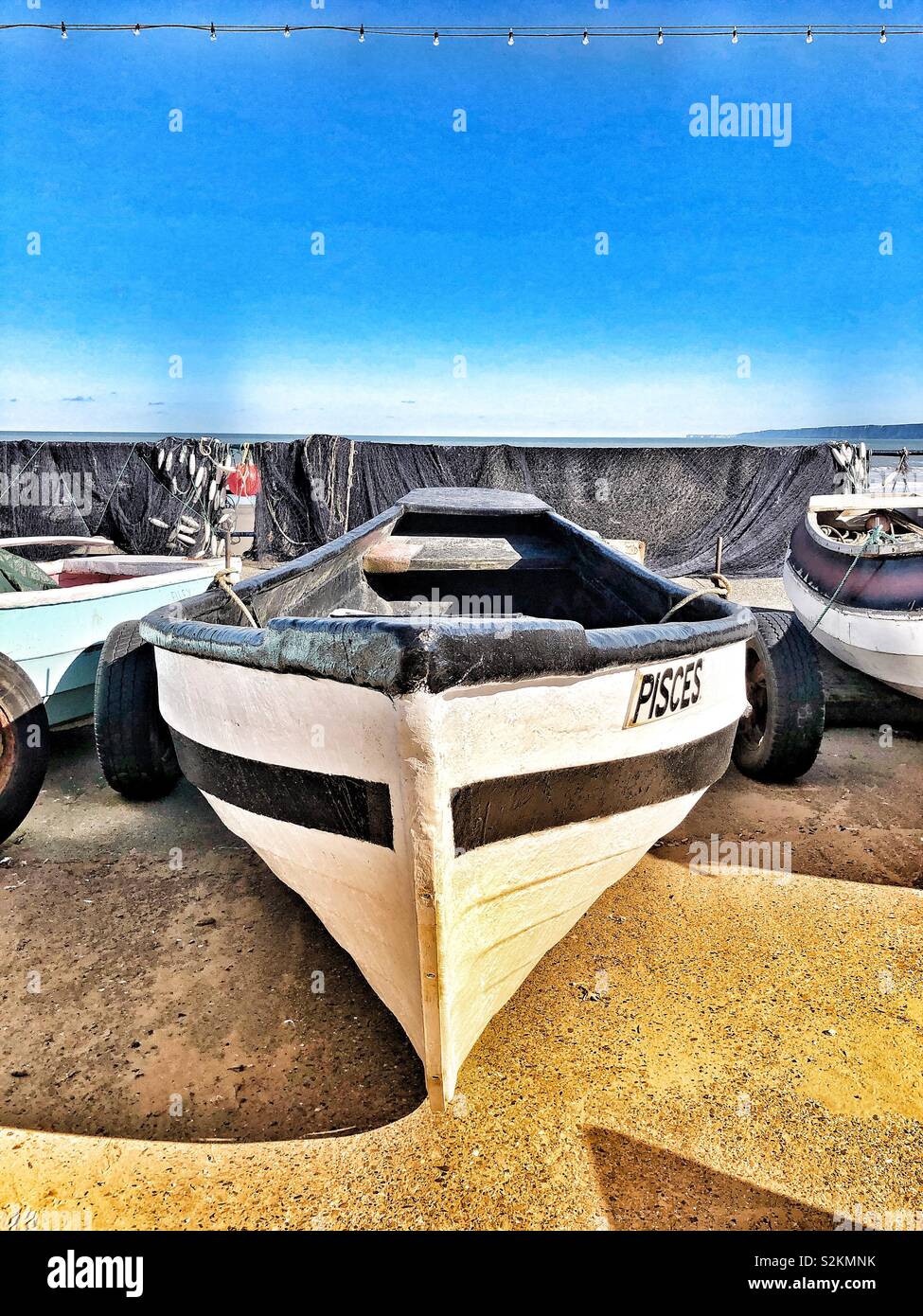 Fishing boat on a slipway on Coble Landing, Filey, North Yorkshire, UK ...