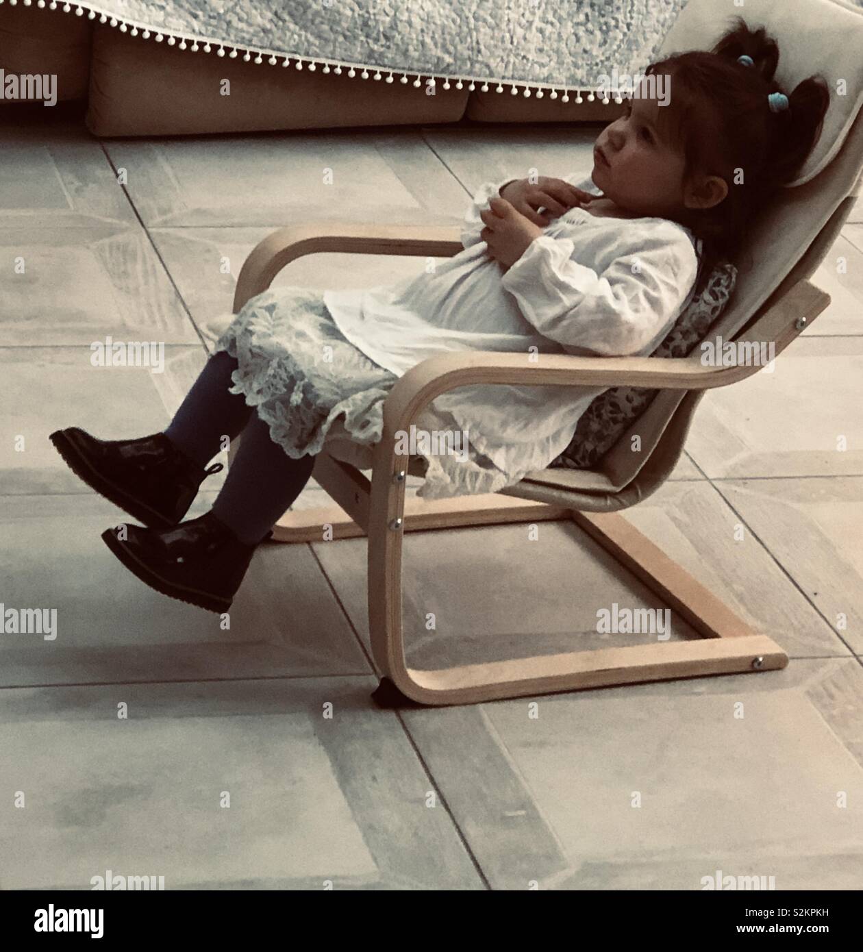 Child in chair Stock Photo - Alamy