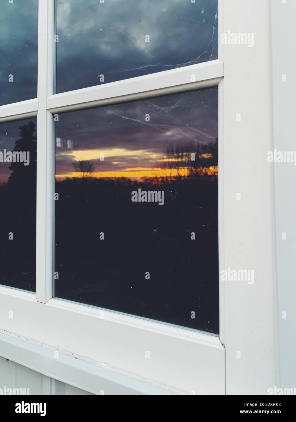 Reflection of sunset in a window pane Stock Photo - Alamy