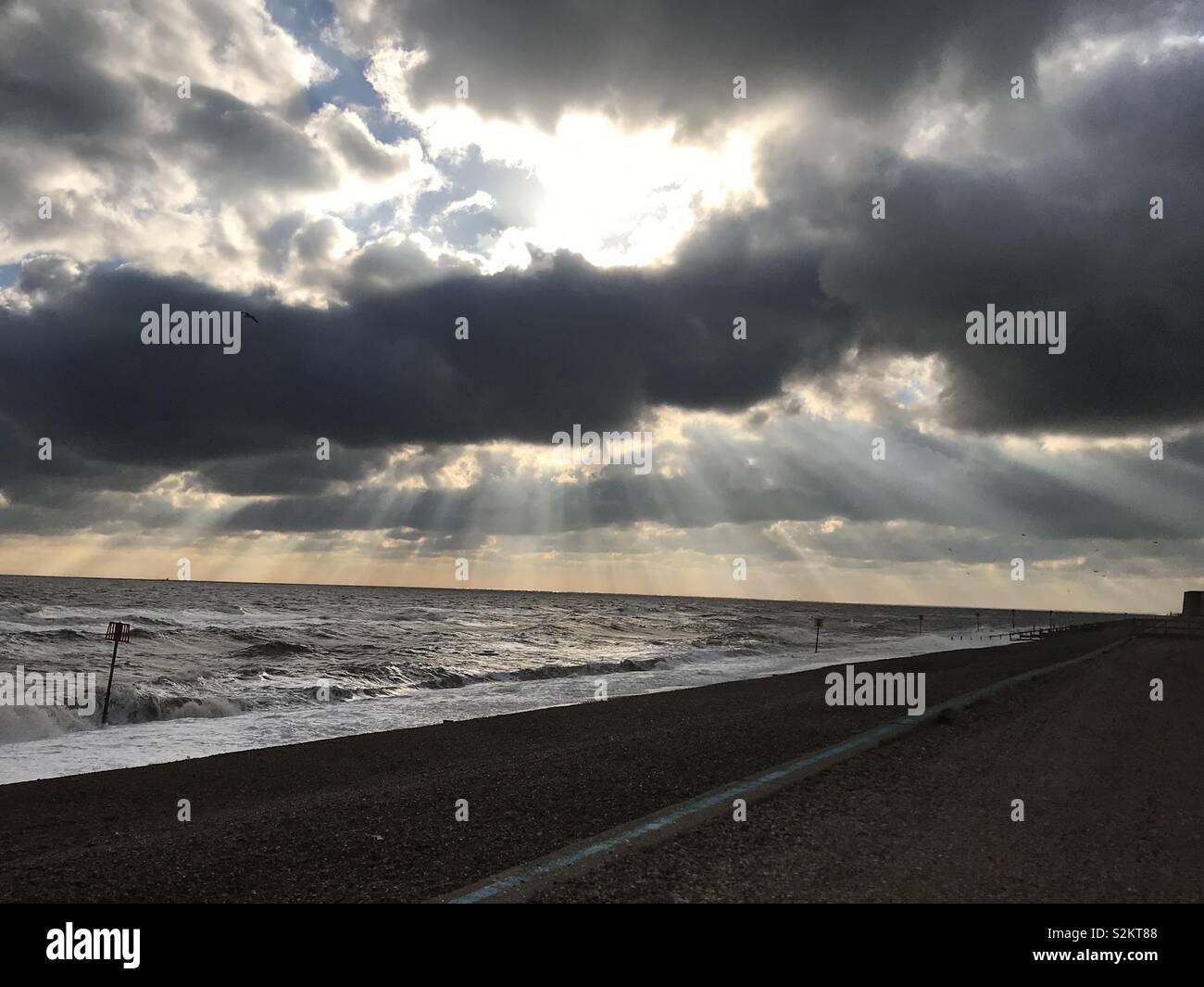 Sun rays through the storm clouds Stock Photo - Alamy