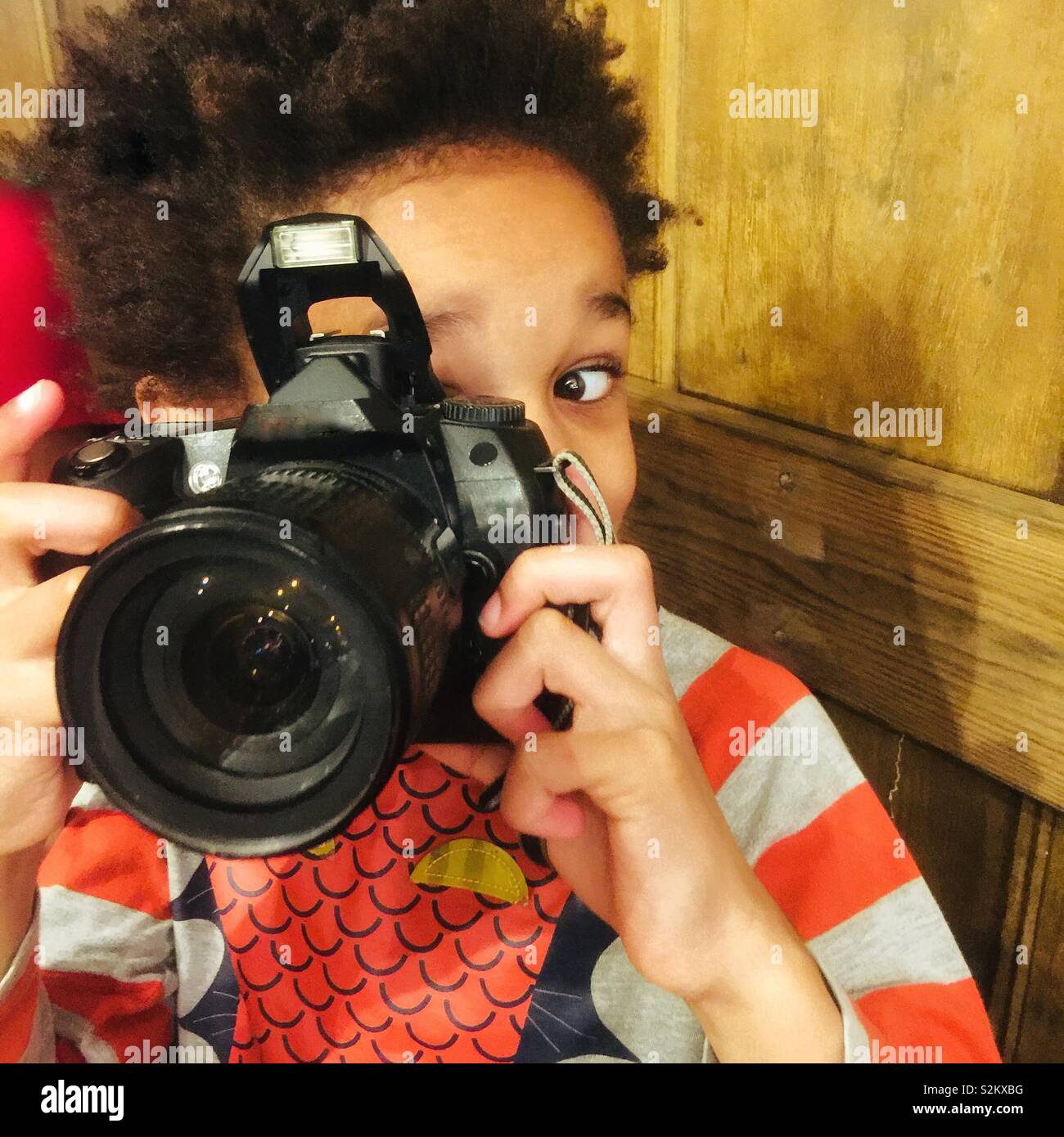 A little boy plays with a camera Stock Photo - Alamy