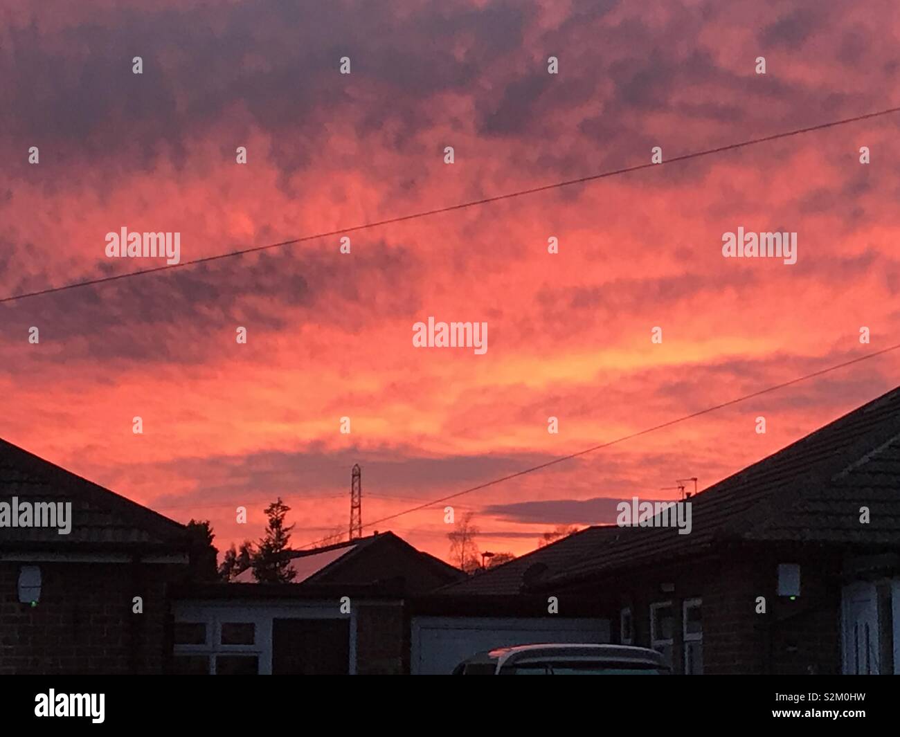 Red sky over houses Stock Photo - Alamy