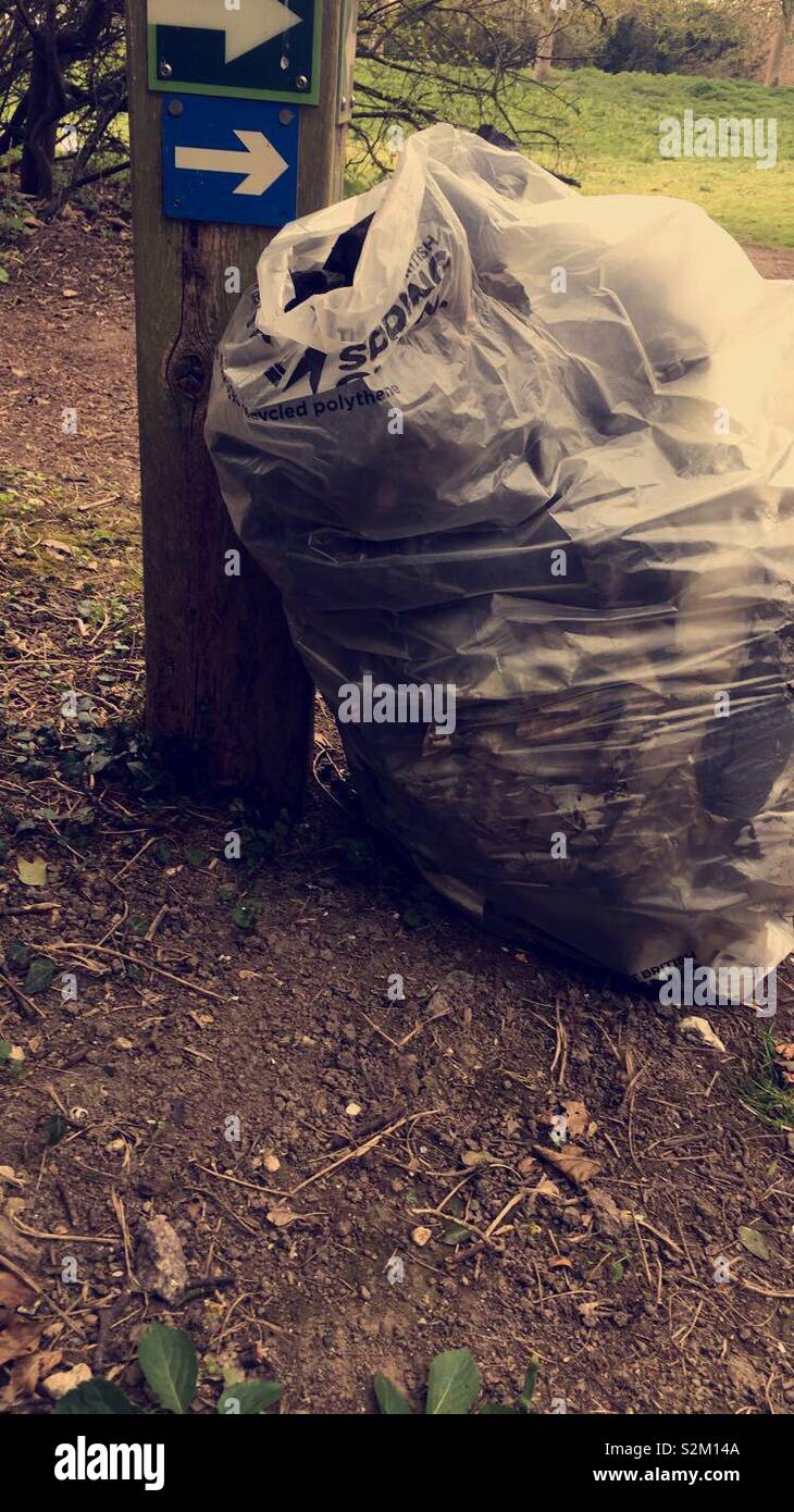 Plastic and see-through rubbish bag leaning on the side of a pole Stock ...