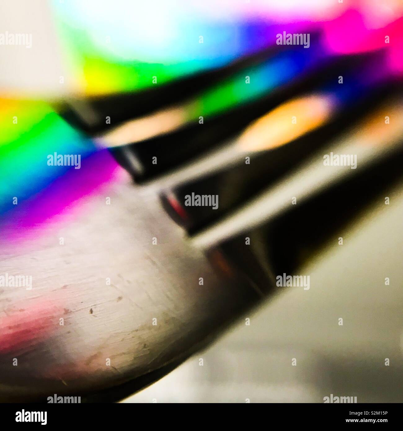 Fork in coloured light Stock Photo - Alamy