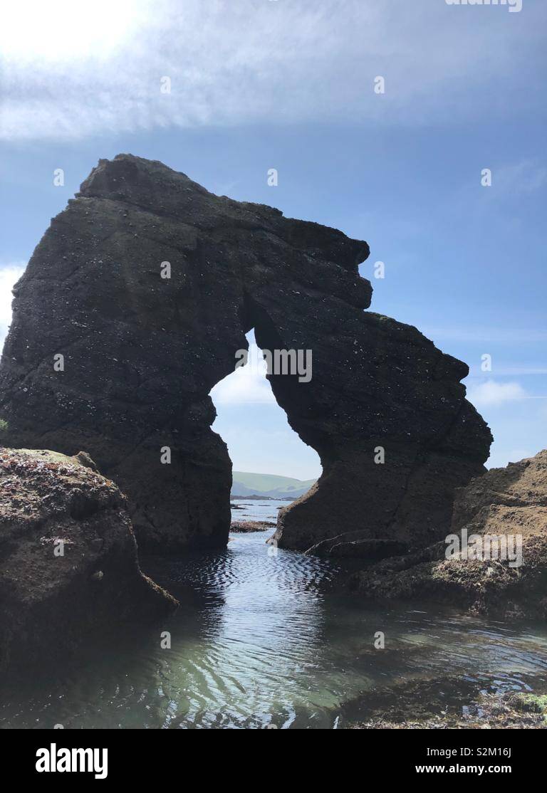 Sun reflection through arch Stock Photo - Alamy